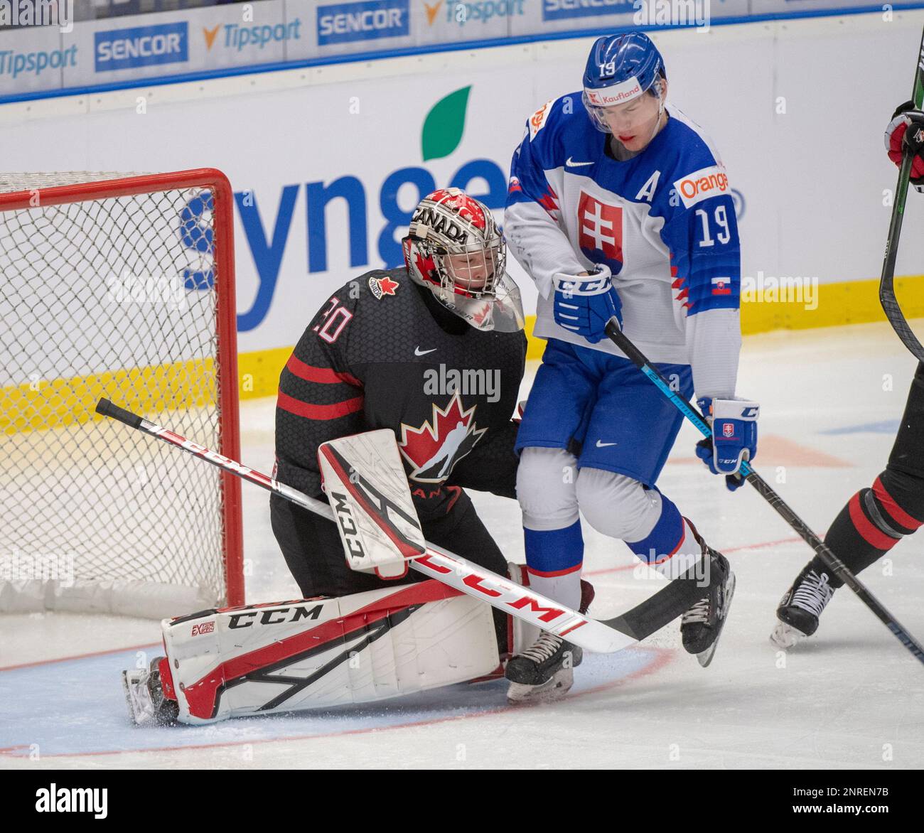 Canada's goaltender Joel Hofer stops Slovakia's Robert Dzugan during ...