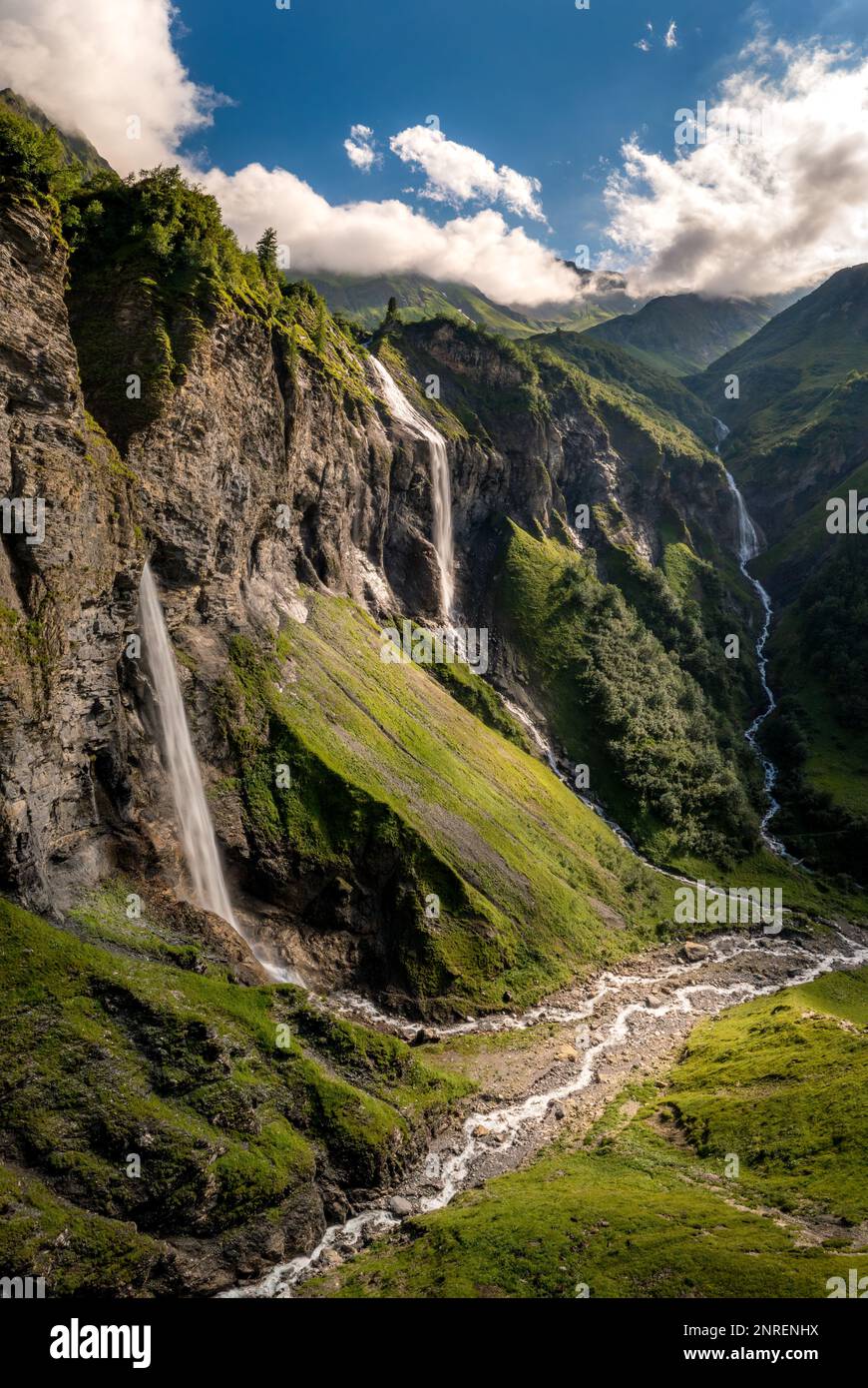 several large waterfalls falling down a steep cliff Stock Photo - Alamy