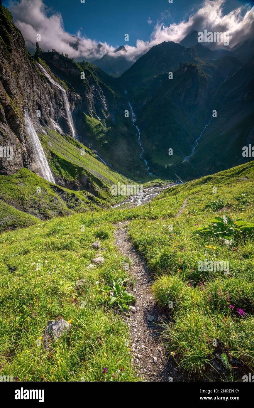 several large waterfalls falling down a steep cliff Stock Photo - Alamy