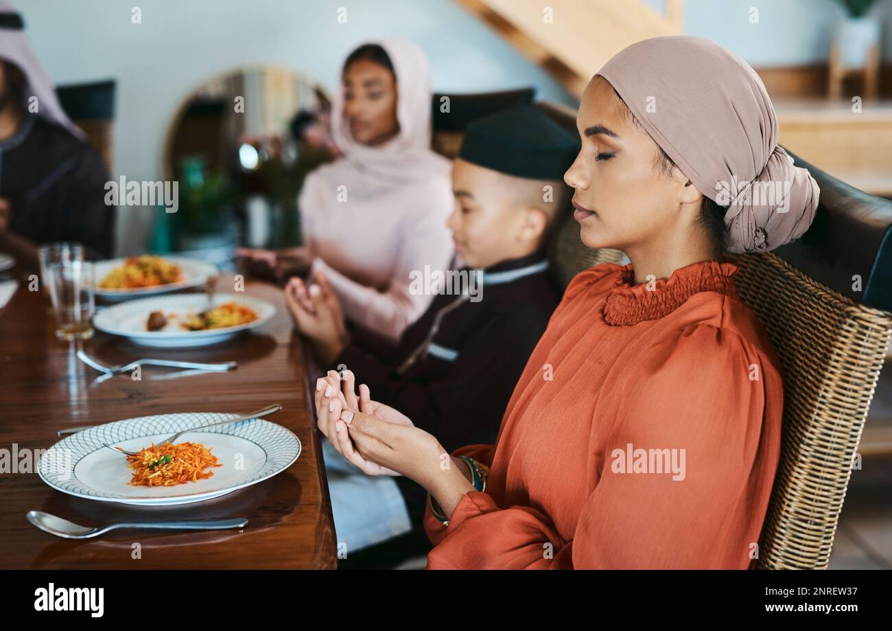 Dont forget to bless your meal. a muslim family praying before eating ...