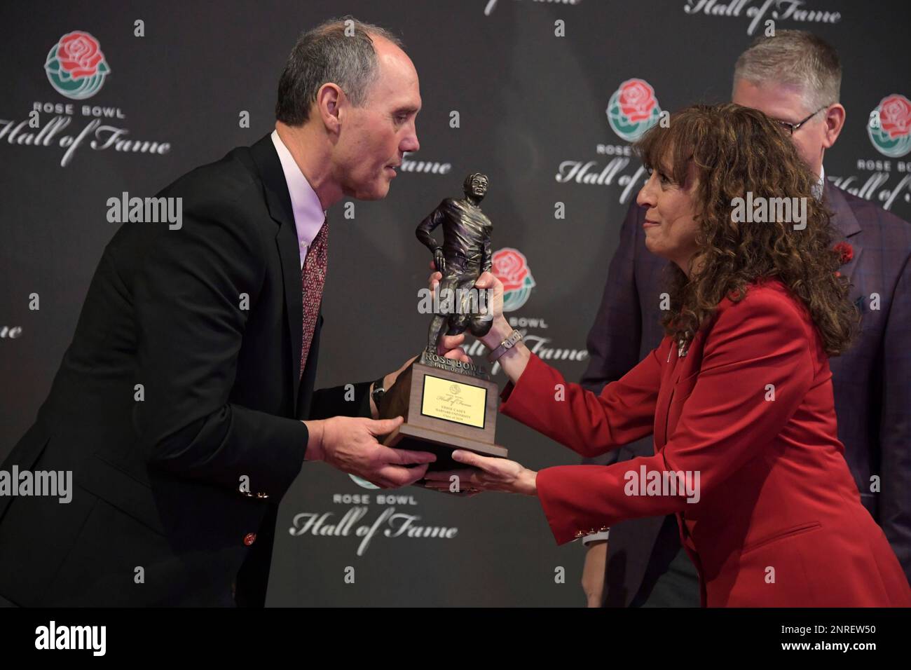 Harvard Crimson coach Tim Murphy is presented Hall of Fame trophy by ...