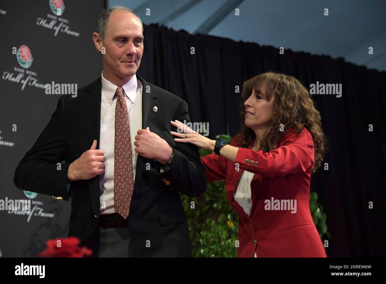 Harvard Crimson coach Tim Murphy is presented Hall of Fame jacket by ...