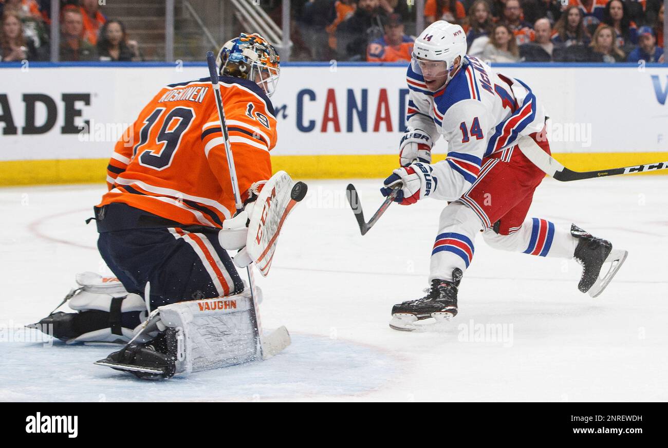 New York Rangers' Greg McKegg (14) is stopped by Edmonton Oilers goalie ...