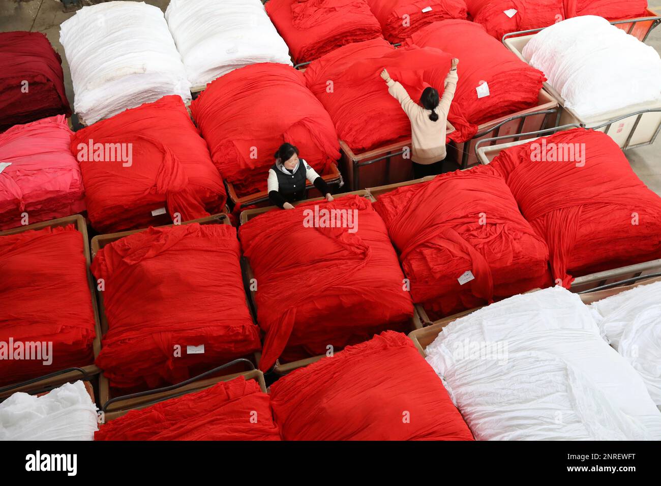 Women labor in a fabric dye factory in Hangzhou in east China's ...