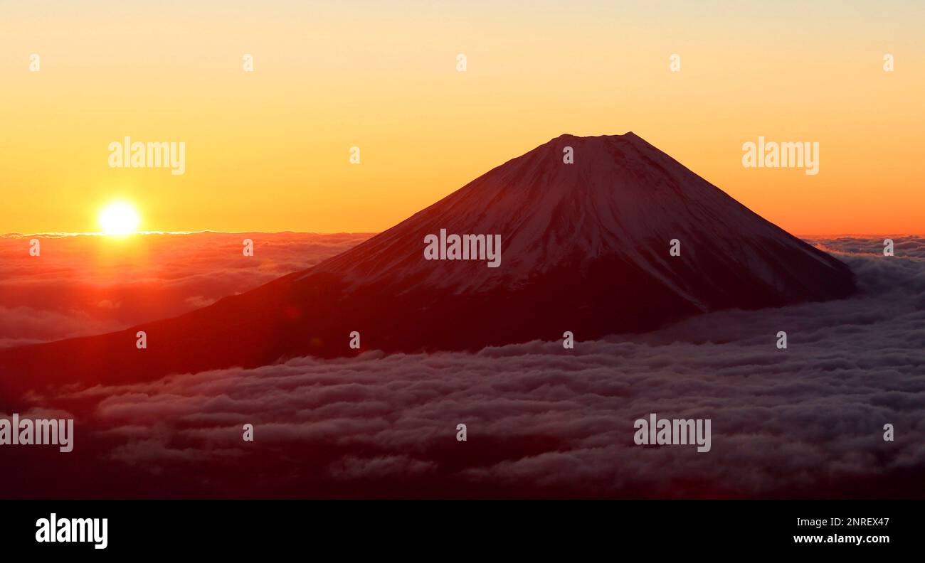 An aerial photo shows the sunrise on New Year's Day with Mt. Fuji in ...