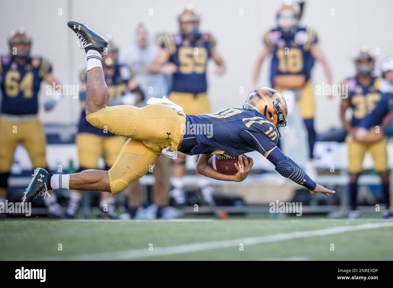 December 31, 2019: Navy Midshipmen quarterback Malcolm Perry (10) dives ...