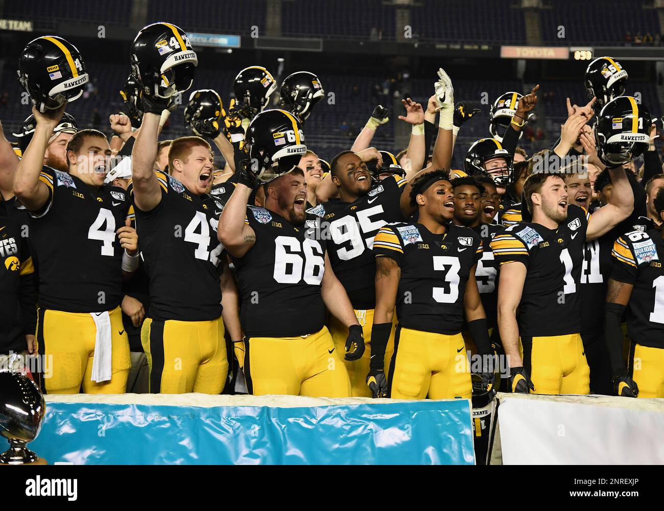 SAN DIEGO, CA - DECEMBER 27: Iowa Hawkeyes players celebrate on the ...
