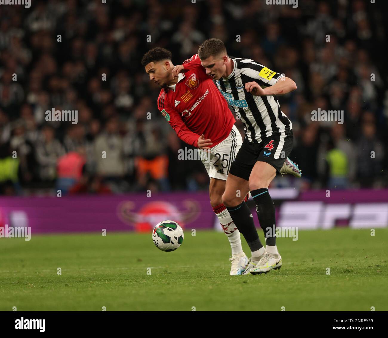 Wembley, UK. 26th Feb, 2023. Jadon Sancho (MU) Sven Botman (NU) at the ...
