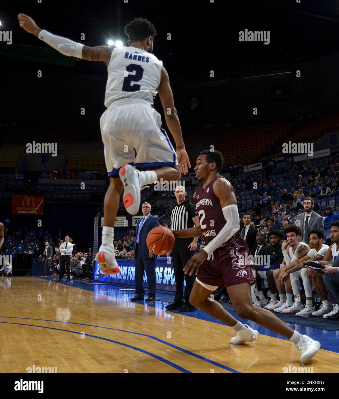 Southern Illinois' Karrington Davis, bottom, fakes out Indiana State's ...