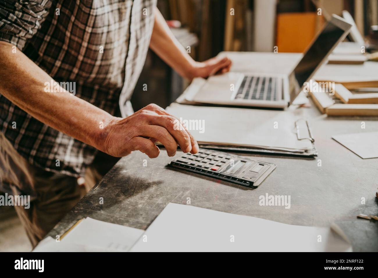 Calculating on calculator hi-res stock photography and images - Alamy