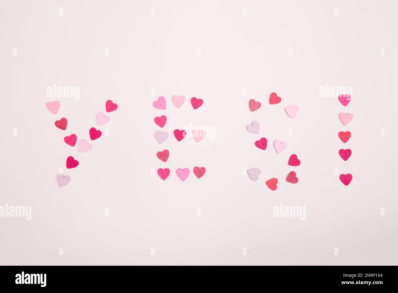 The word yes and an exclamation mark made from hearts on a gray ...