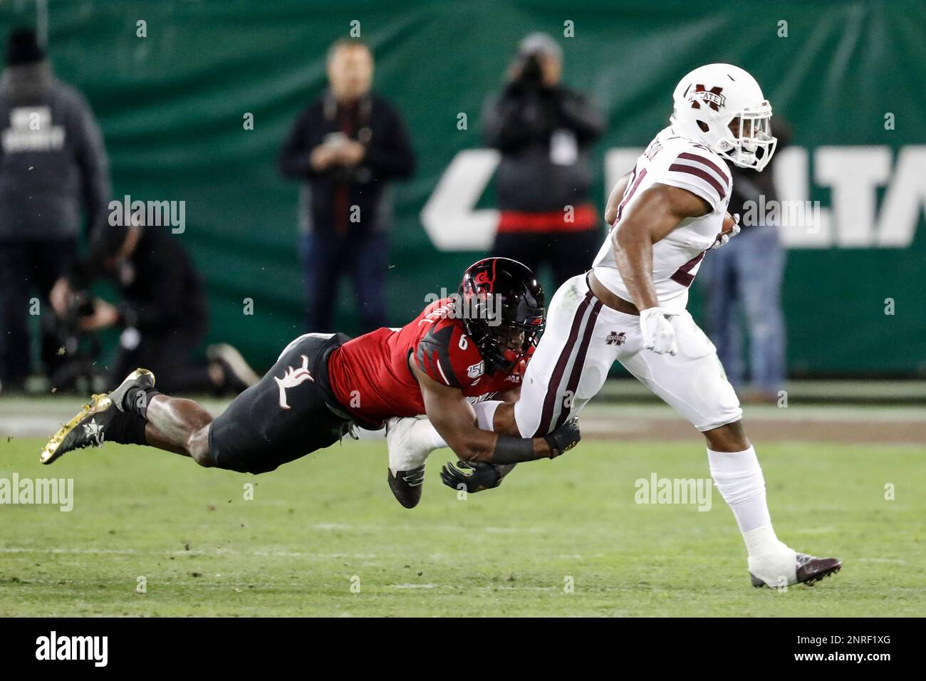 Mississippi State running back Nick Gibson (21) tries to get away from ...