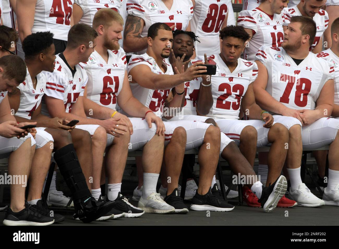 Wisconsin Badgers players Tyler Biadasz (61), Zack Baun (56), Jonathan ...