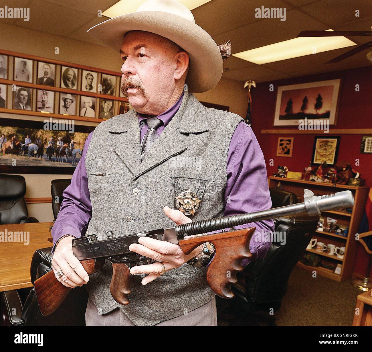 Holding a vintage 1927-era Tommy Gun, Yuma County Sheriff Leon Wilmot ...