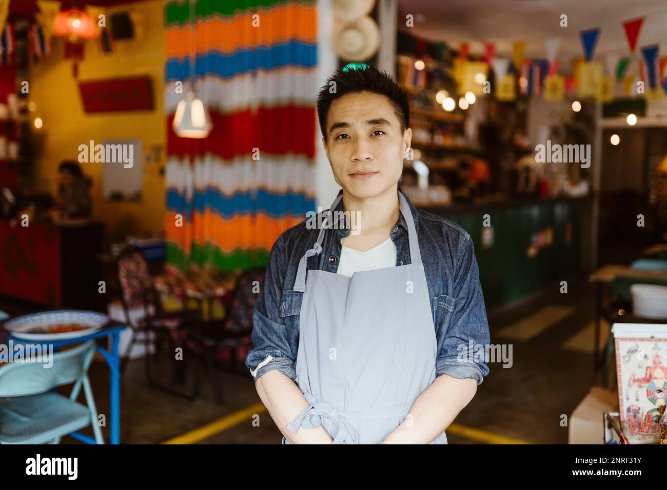 Portrait of confident male restaurant owner wearing apron Stock Photo ...