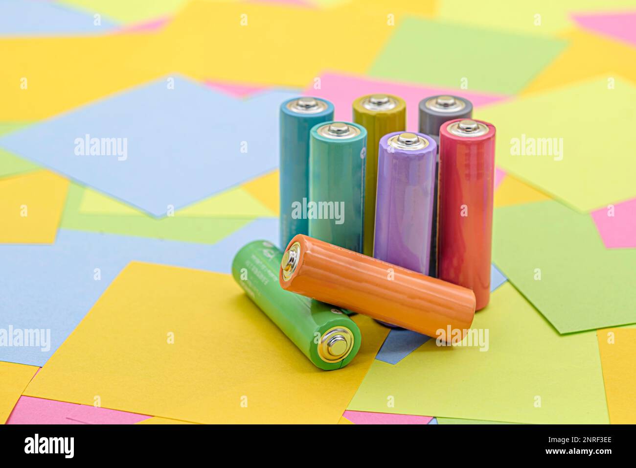 Cylindrical batteries of various colors with multicolored paper sticky ...
