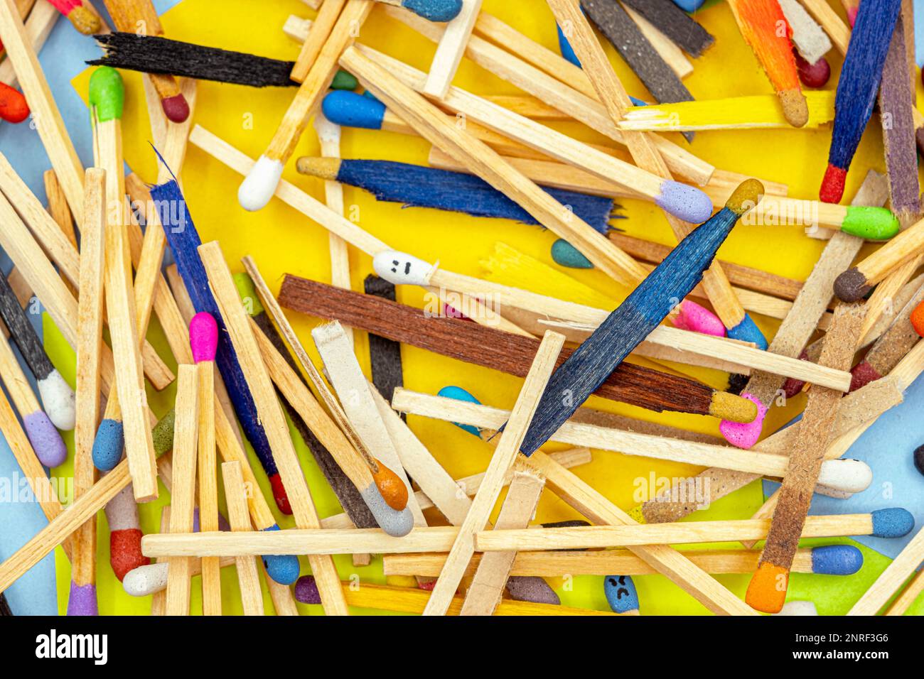 matchsticks of various shapes and colors with multicolored paper sticky ...