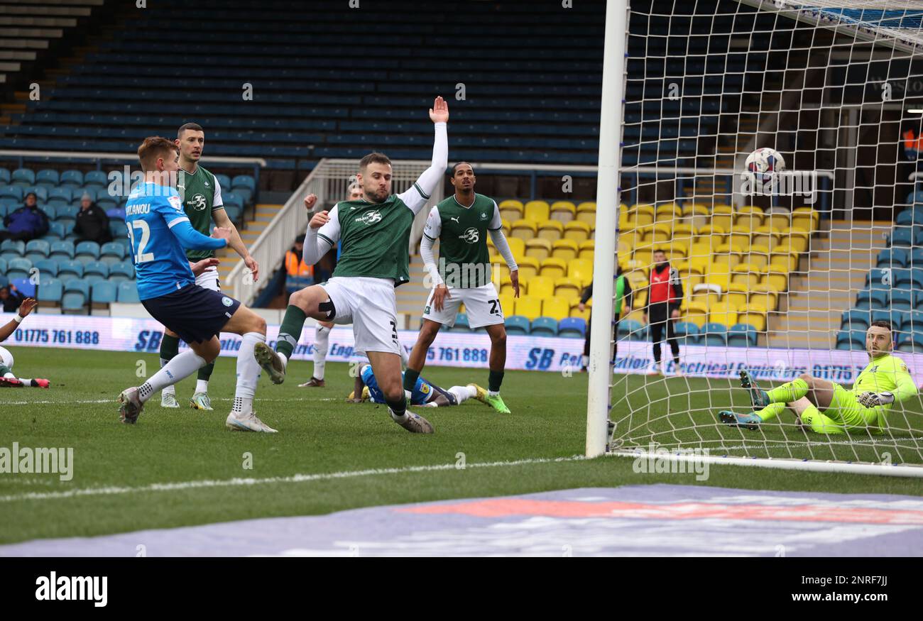 Peterborough, UK. 25th Feb, 2023. Hector Kyprianou (PU) scores the ...