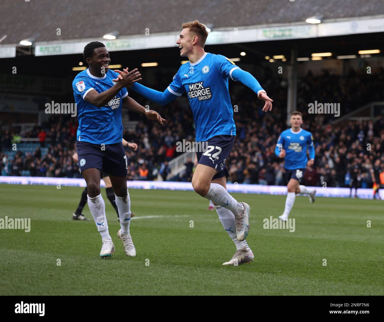 Peterborough, UK. 25th Feb, 2023. Hector Kyprianou (PU) celebrates ...