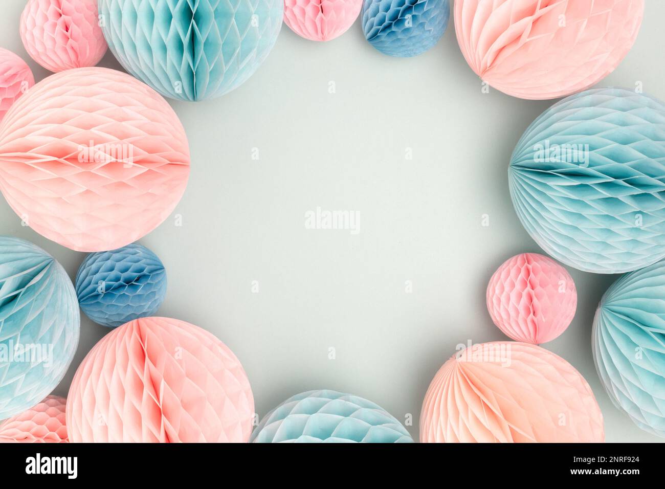 Border frame made of tissue paper balls different sizes in a pink and ...