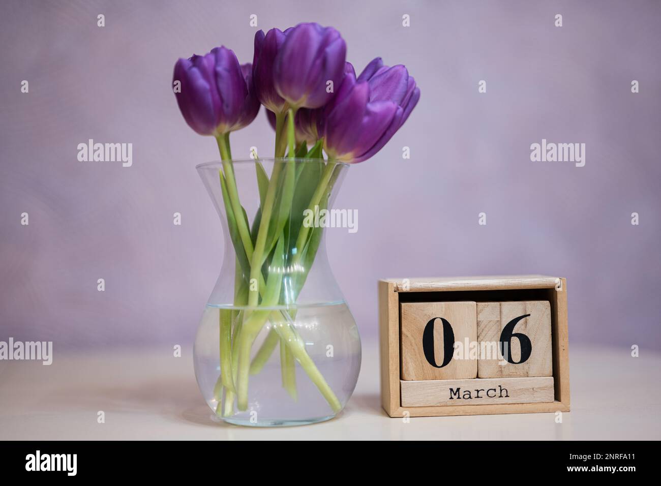 Hello spring! Wooden cubic calendar with date of 6 March surrounded ...