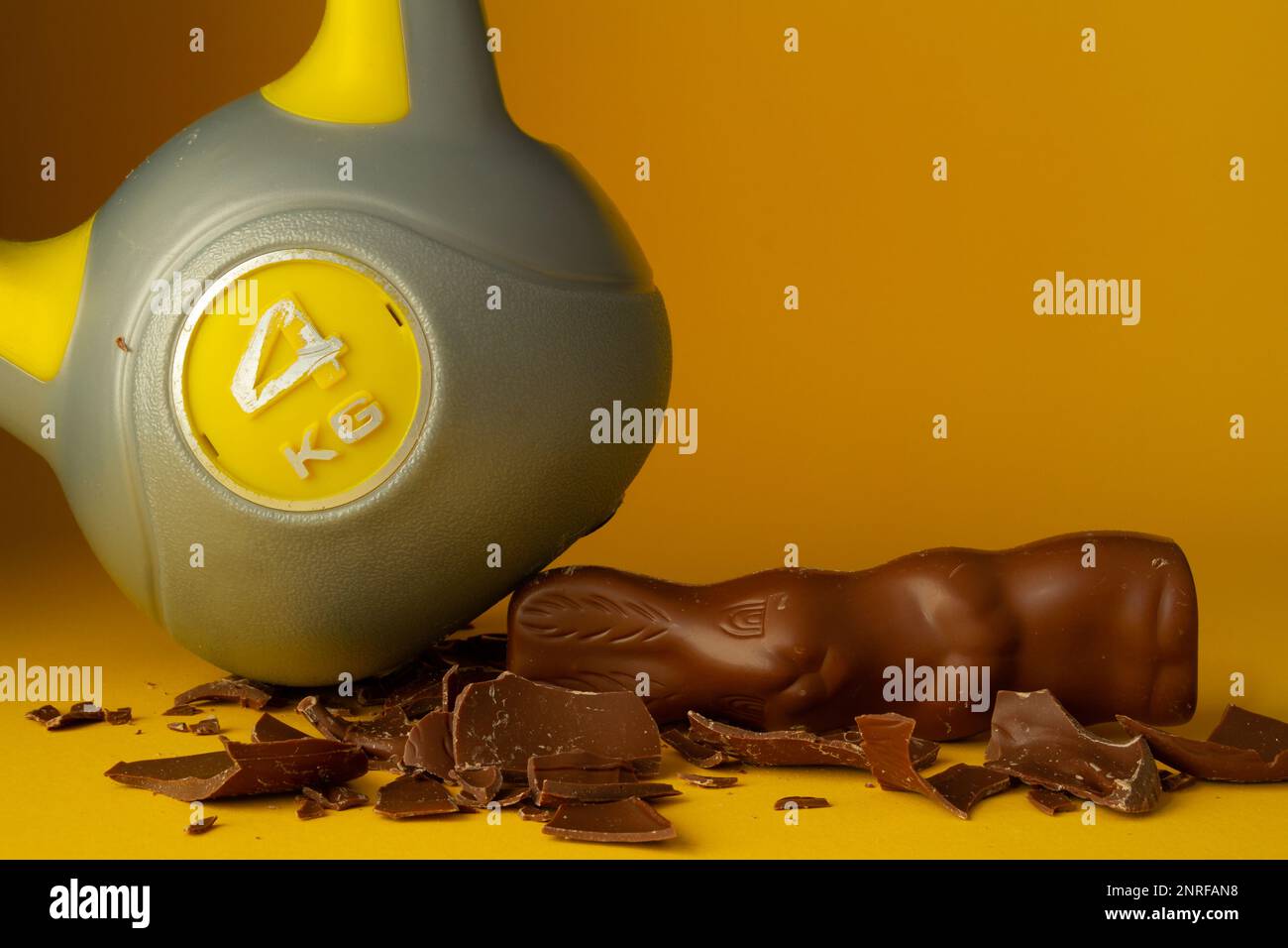 Kettlebell crushing Easter chocolate bunny. Gym workout, fitness ...