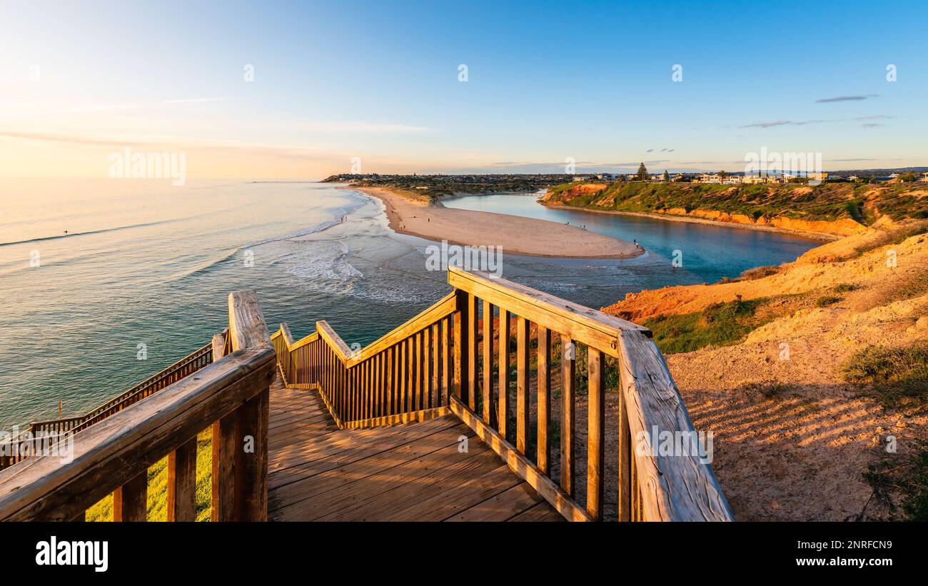South Port beach boardwalk viewed towards Onkaparinga River at sunset ...