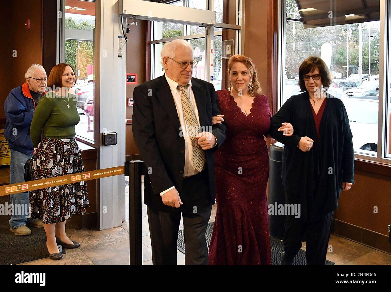 Bride Valerie Sneade walks down the aisle by her parents Richard Sneade ...