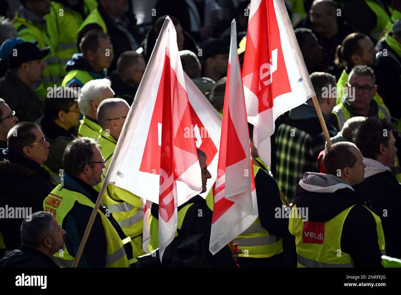 Duesseldorf, Germany. 27th Feb, 2023. Striking airport employees stand ...