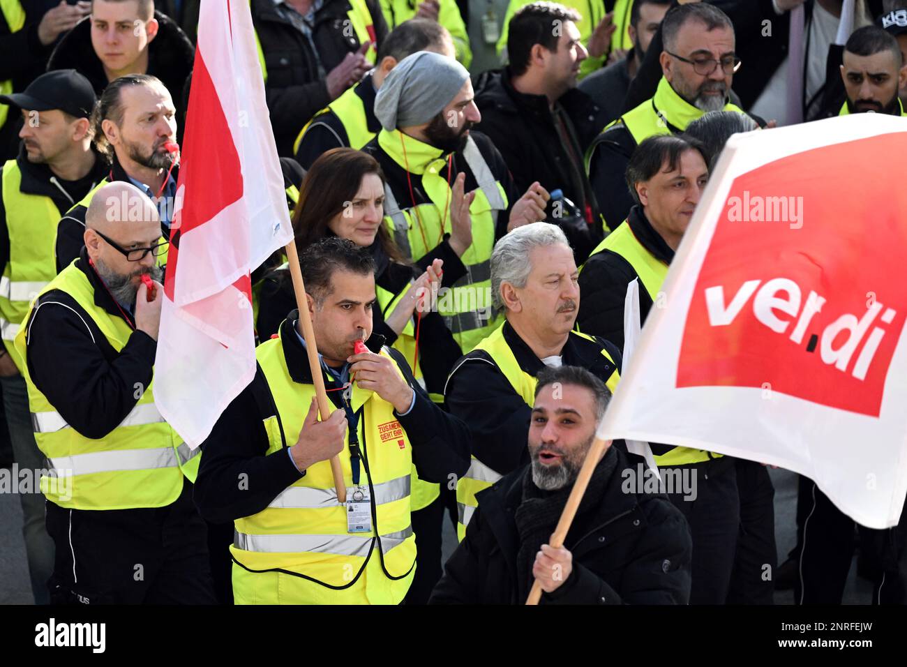Duesseldorf, Germany. 27th Feb, 2023. Striking airport employees stand ...
