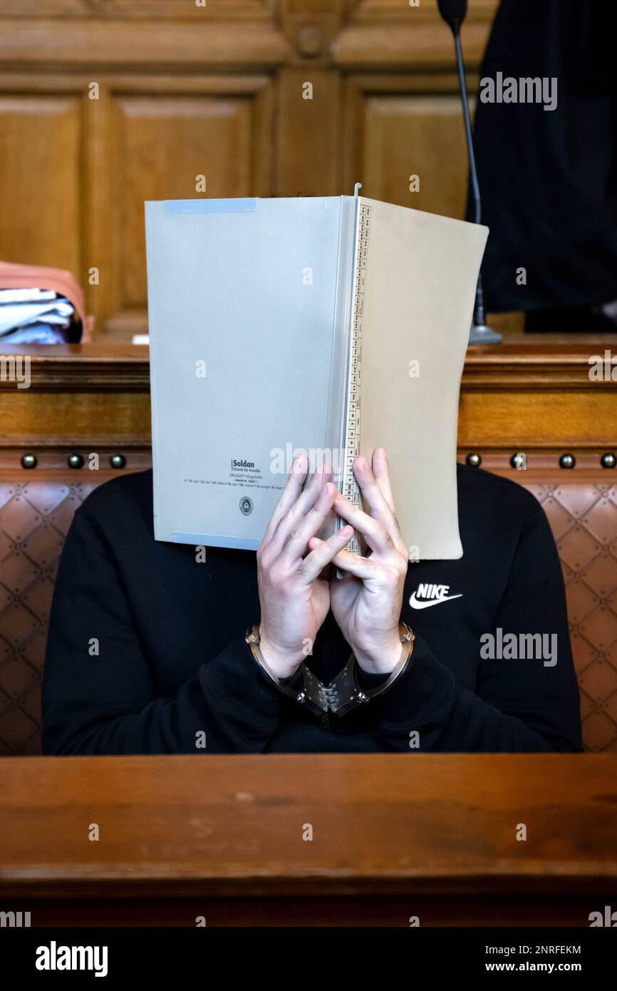 Bremen, Germany. 27th Feb, 2023. The defendant sits in the courtroom ...