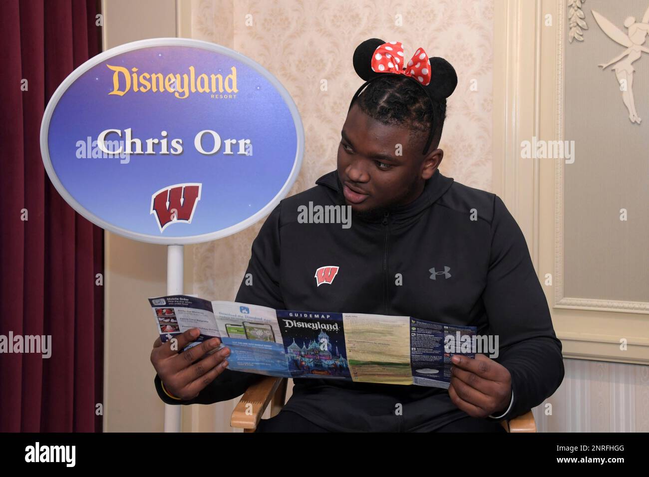 Wisconsin Badgers linebacker Chris Orr reads a Disneyland guide map ...