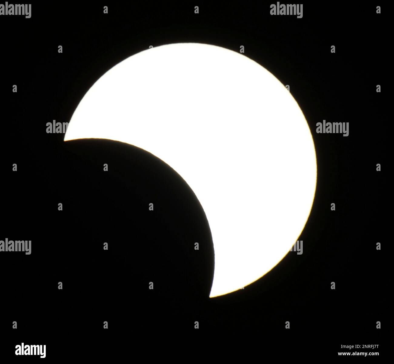 A photo shows a partial solar eclipse observed in Nago City, Okinawa on ...