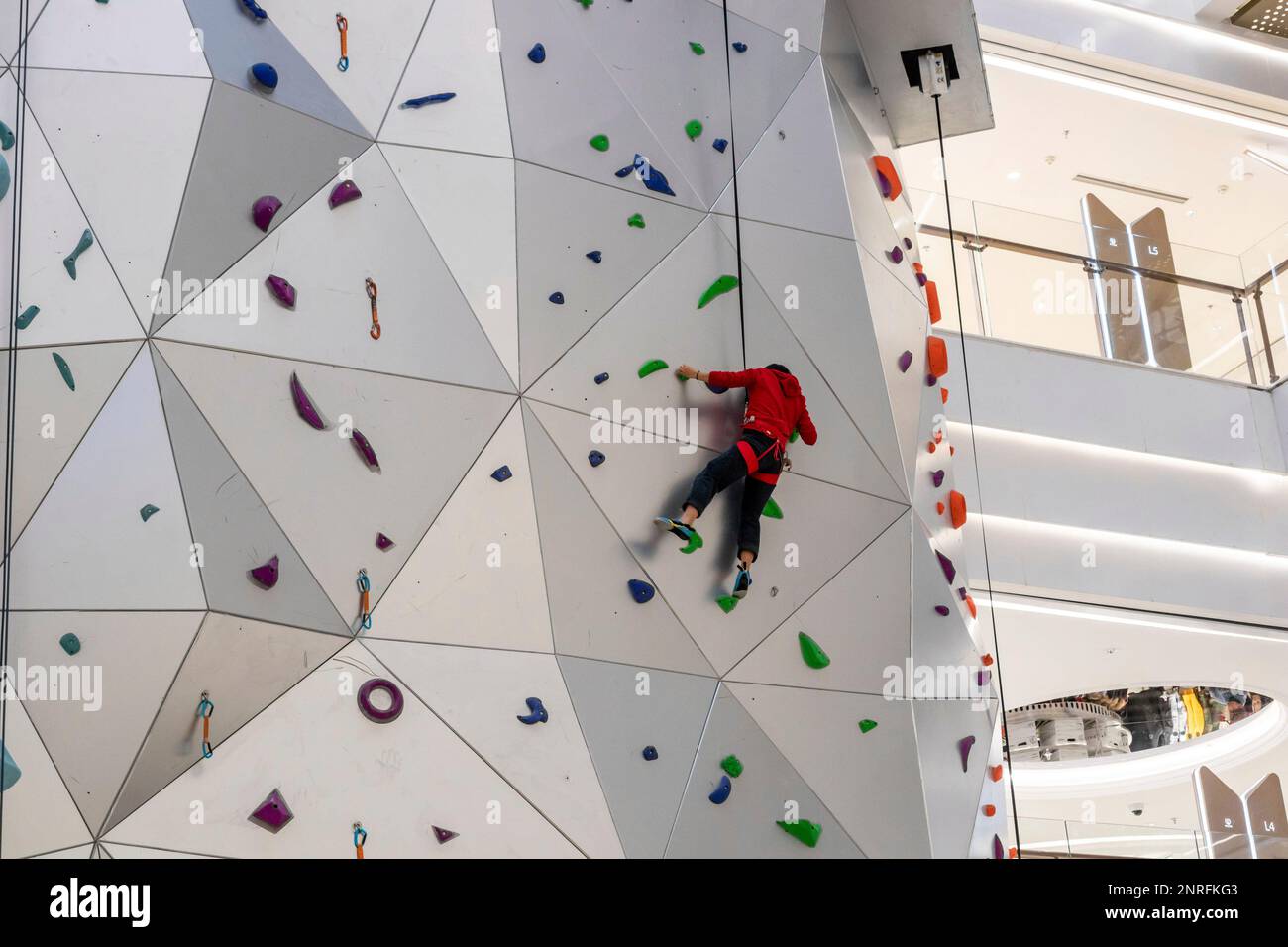 A girl tries the 55-meter-tall climbing wall in a refurbished ...