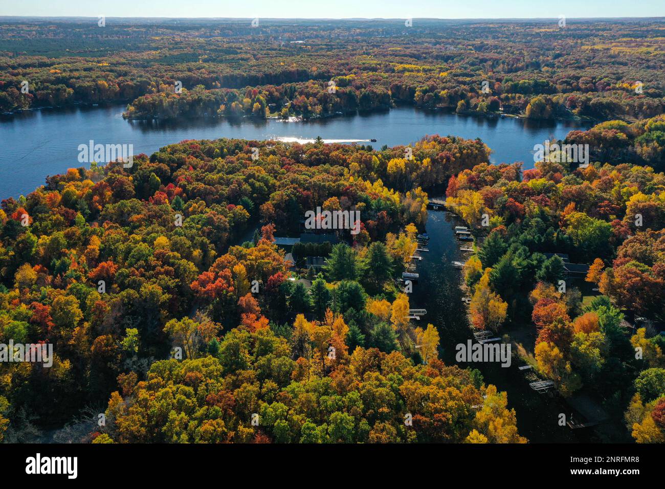 Water and fall colored trees Stock Photo - Alamy