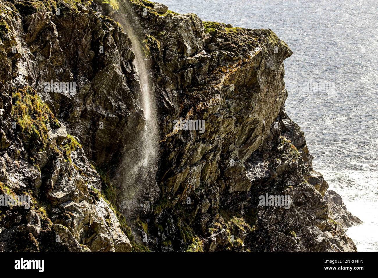 Backward waterfall on cliff in Ireland Stock Photo - Alamy