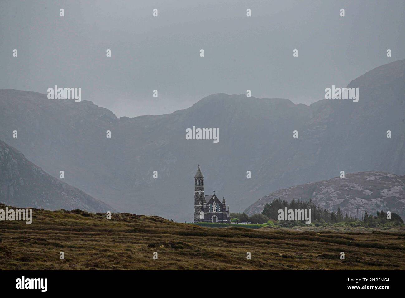 Church among high hills in Ireland Stock Photo - Alamy