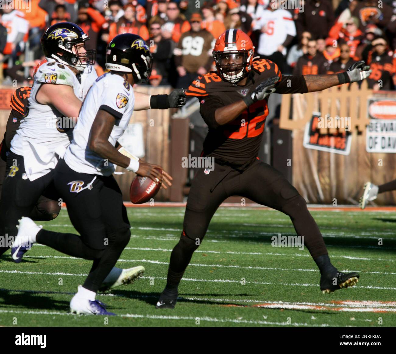 Cleveland Brown's Chad Thomas (92) chases Baltimore Raven quarterback ...