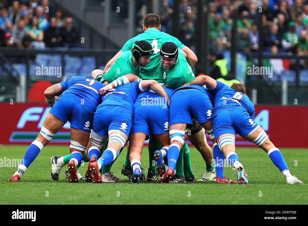 Italy's and Ireland's players fight for the ball in a scrum during the ...