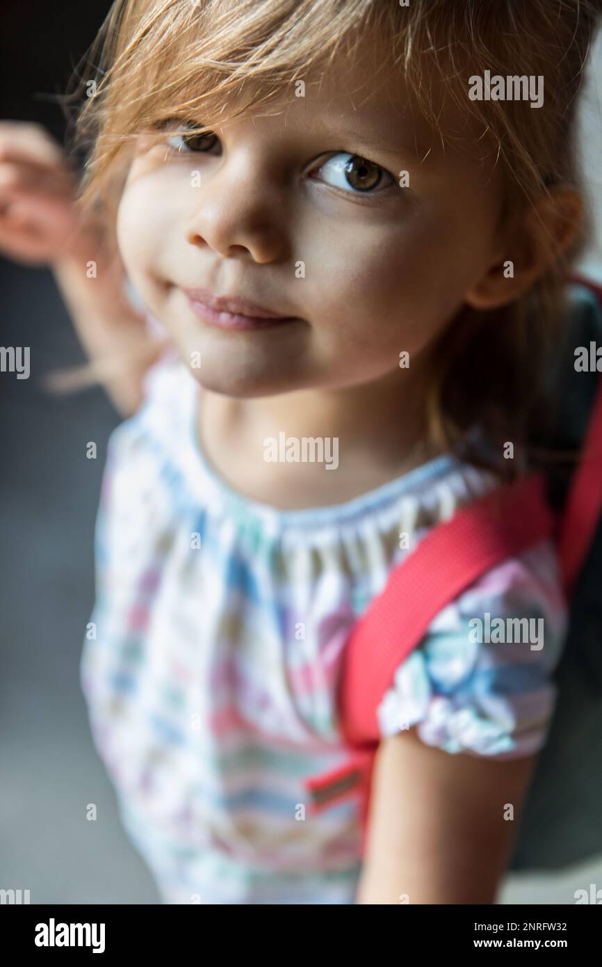 Close up of preschool aged girl standing outside Stock Photo - Alamy