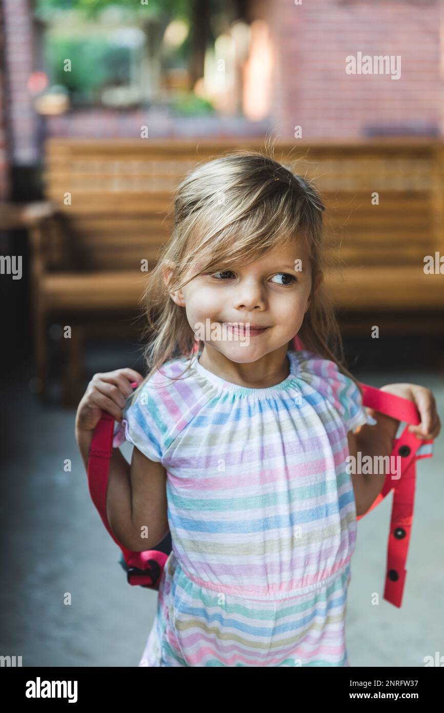 Girl wearing backpack school hi-res stock photography and images - Alamy