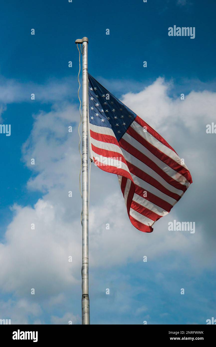 American flag blowing in the wind Stock Photo - Alamy