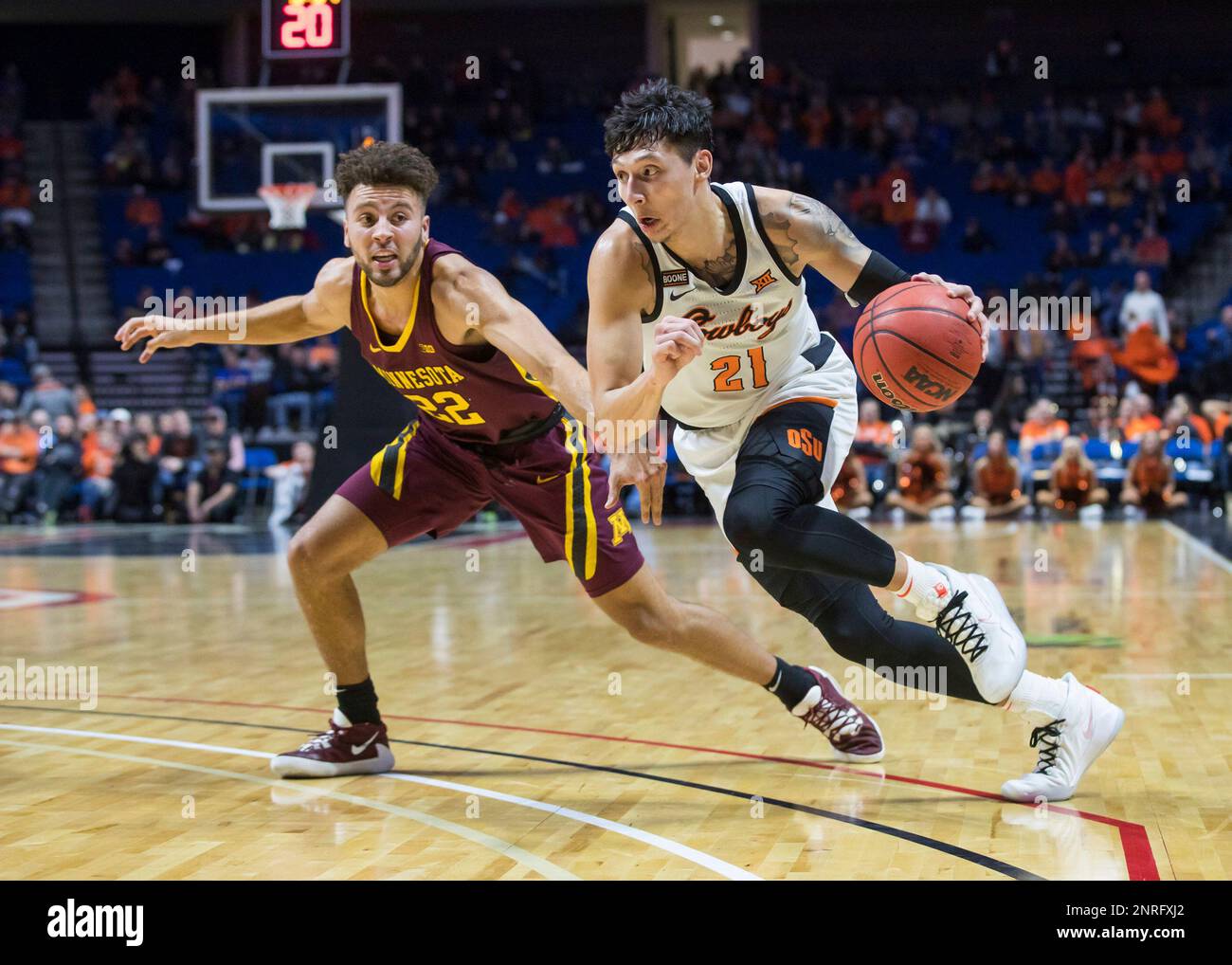Oklahoma State Cowboys guard Lindy Waters III (right) dribbles around ...