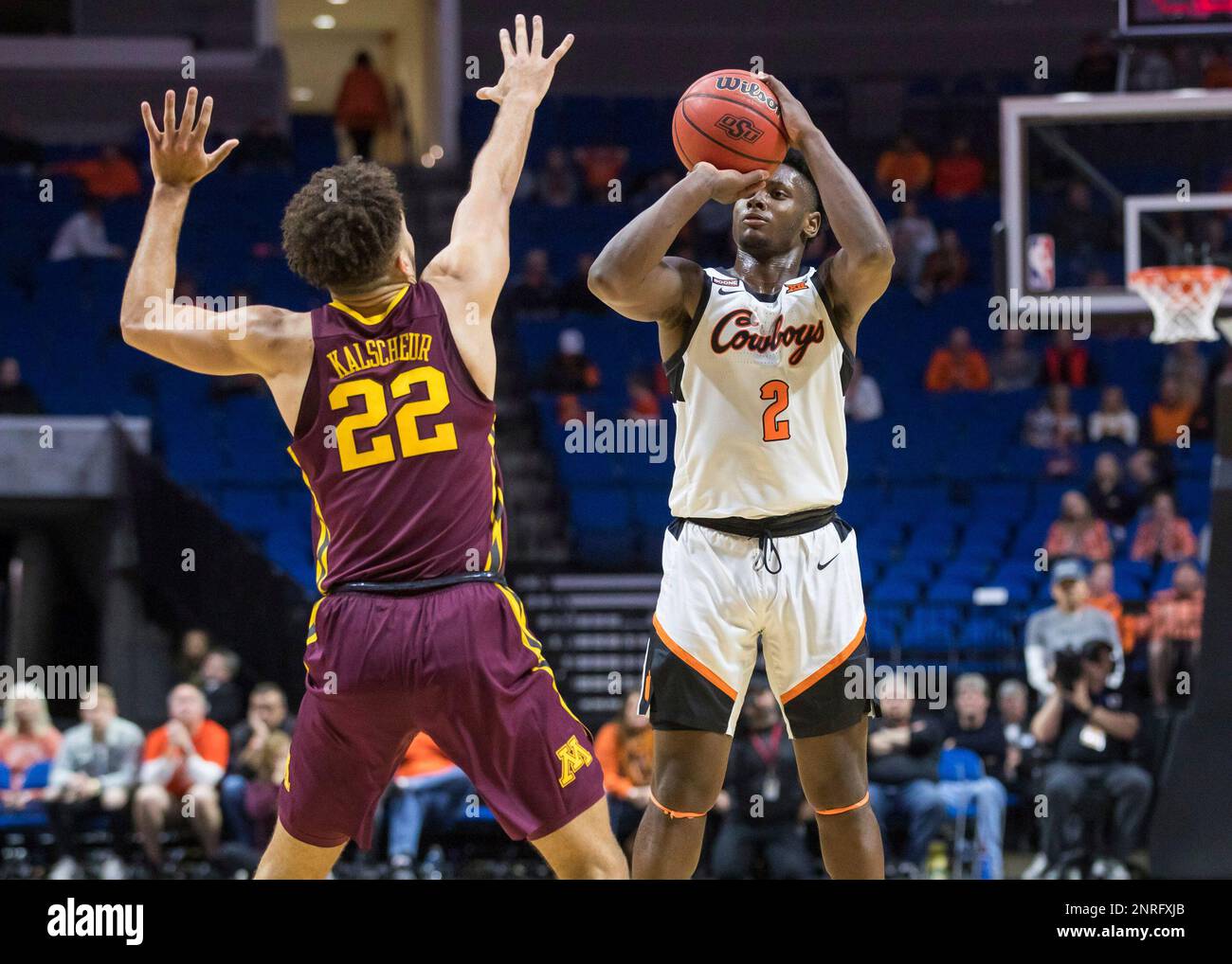 Oklahoma State Cowboys guard Chris Harris Jr. (right) shoots over ...