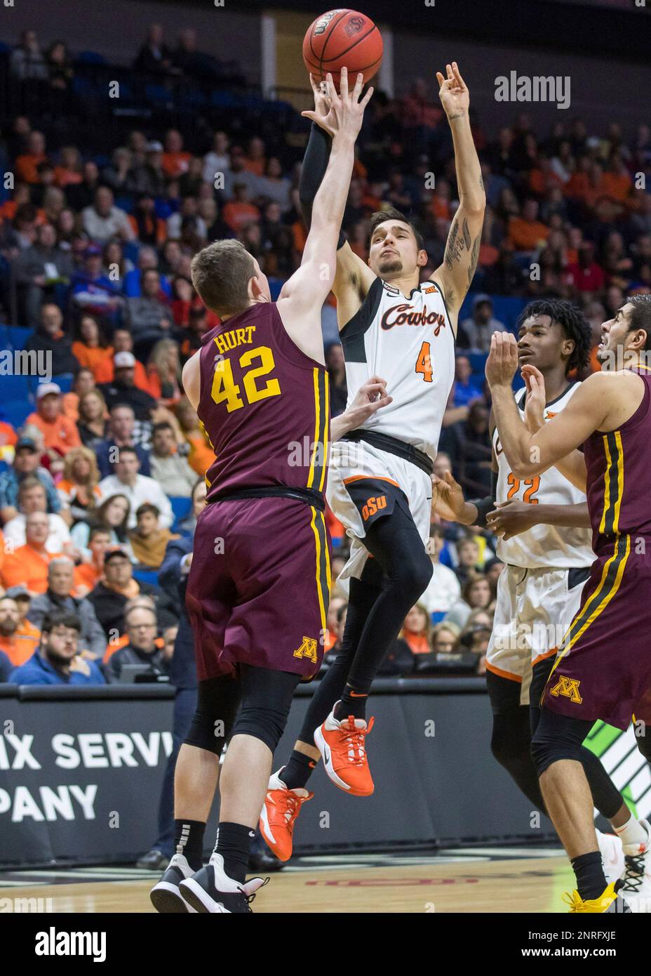 Oklahoma State guard Thomas Dziagwa shoots hoots a fadeaway jump shot ...