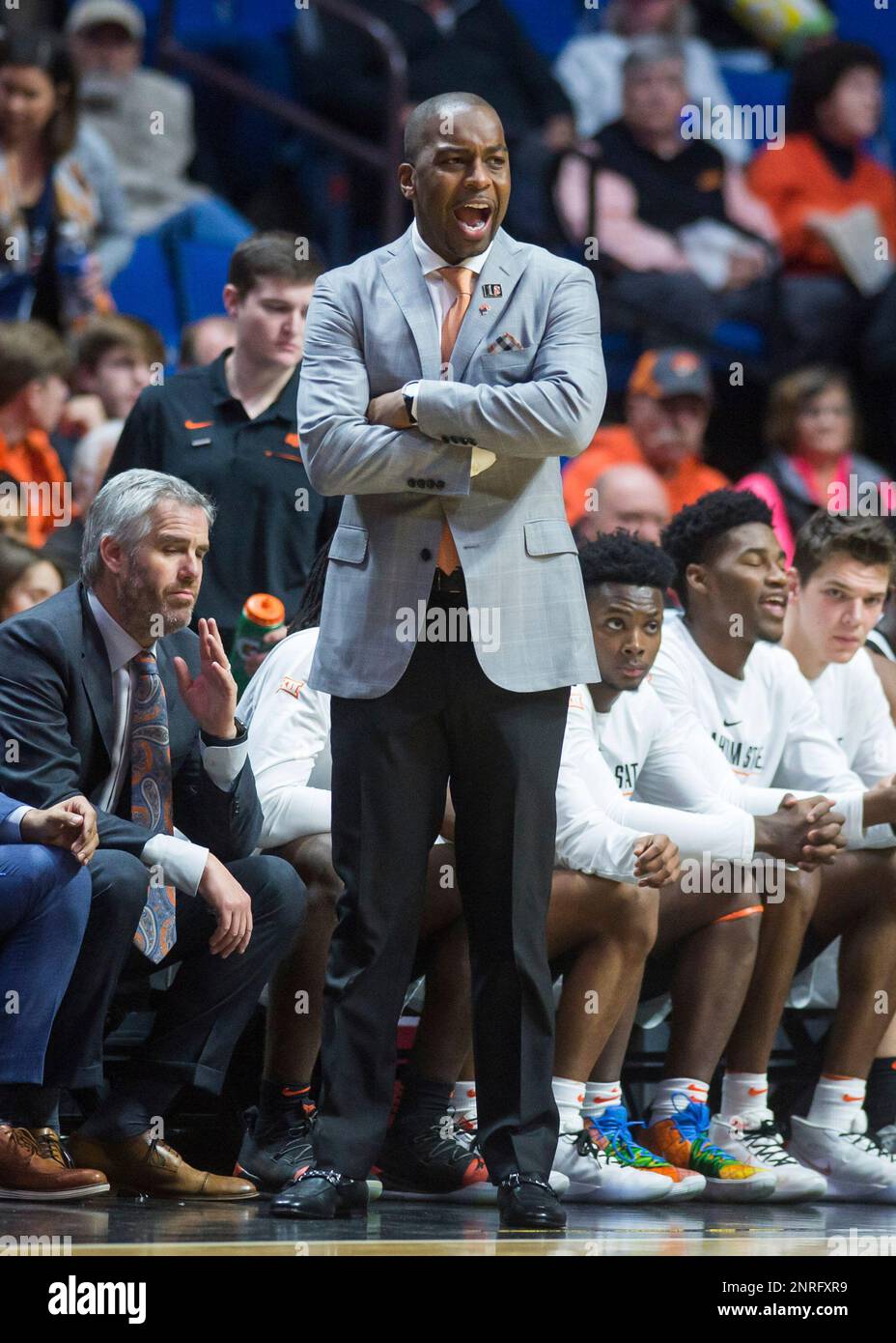Oklahoma State coach Mike Boynton Jr. yells to his players on the floor ...