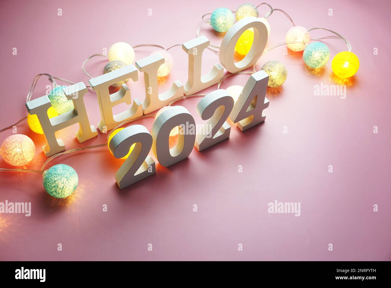 Hello 2024 alphabet letter with cotton ball LED decoration on pink ...