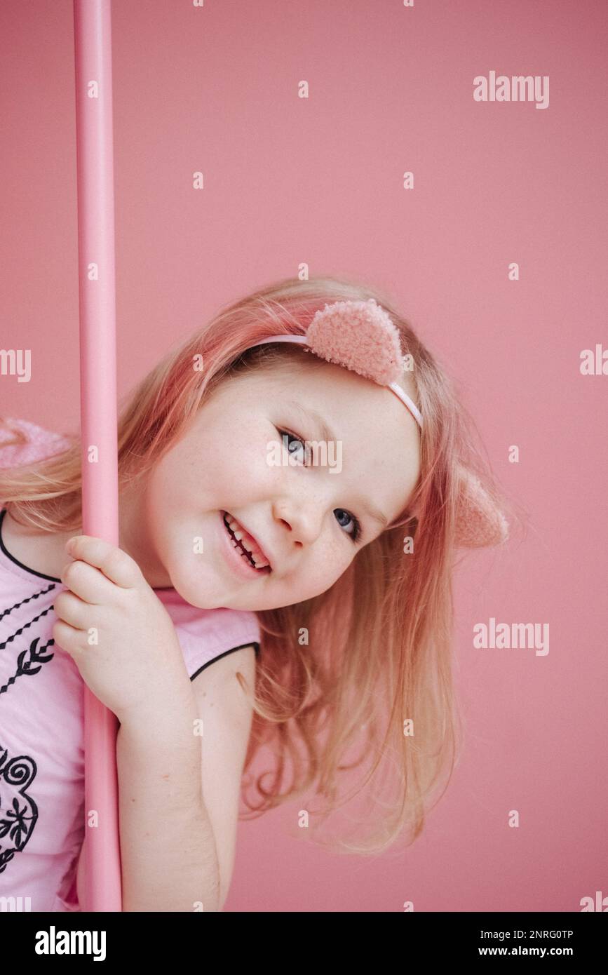 Girl in pink smiling hi-res stock photography and images - Alamy
