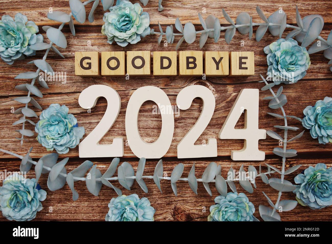 Goodbye 2024 alphabet letters with flower decorate on wooden background ...