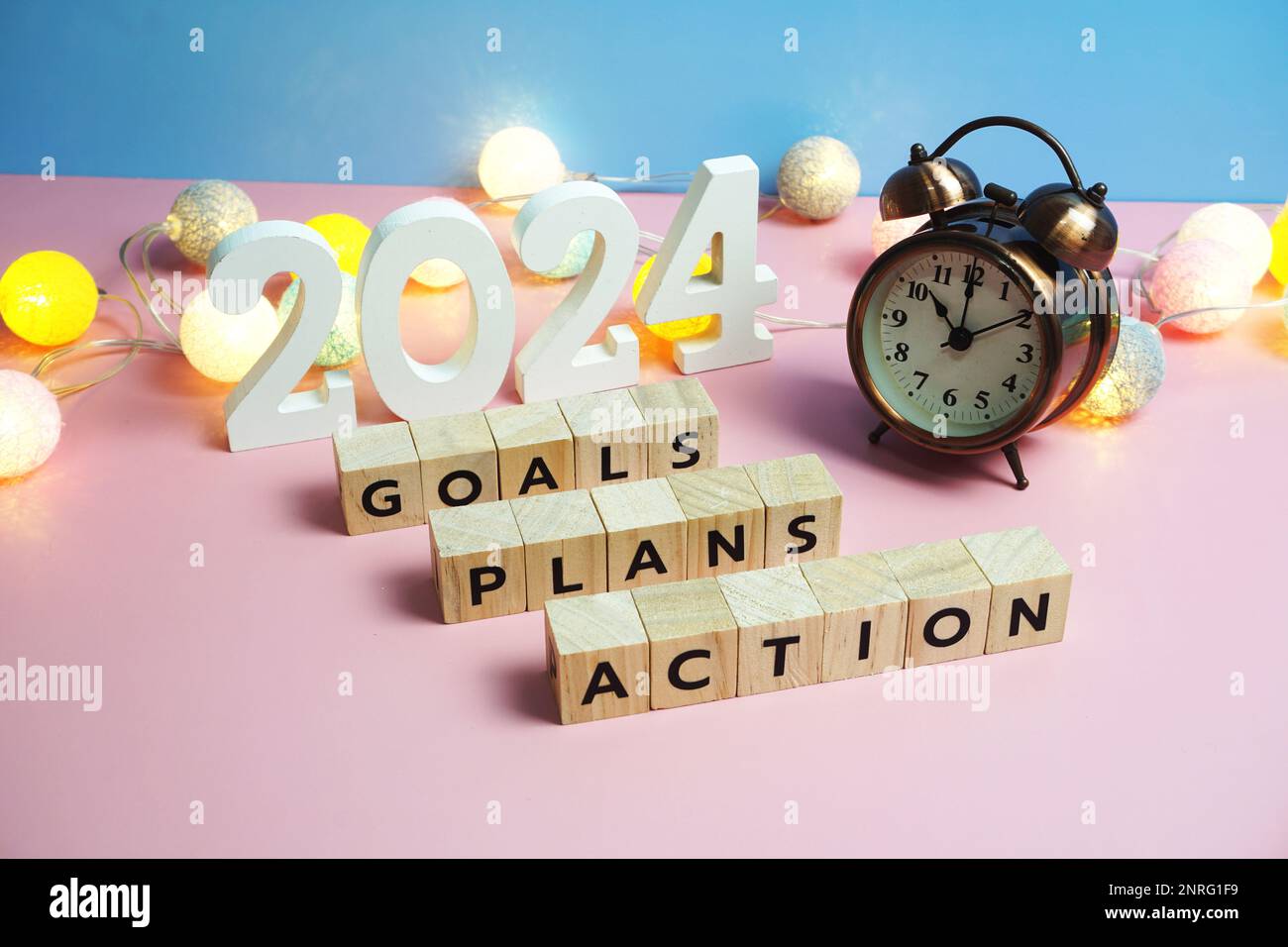 2024 new year goals, plan, action alphabet letters on blue and pink ...